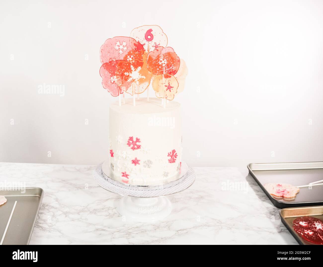 Baking tall round cake with large lollipops for a little girl's ...
