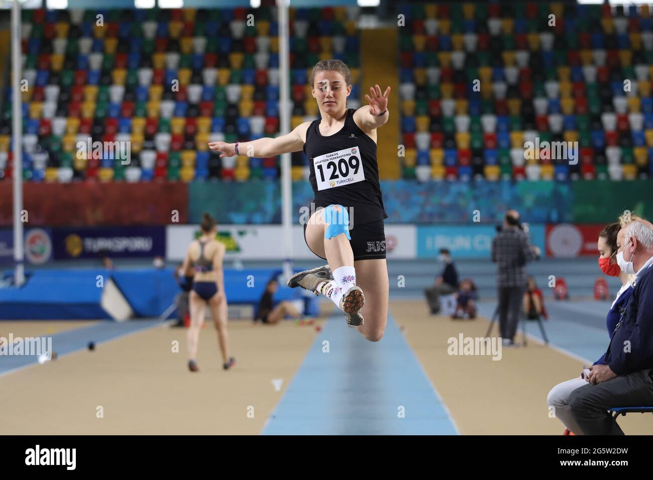 ISTANBUL, TURKEY - MARCH 07, 2021: Undefined athlete long jumping ...