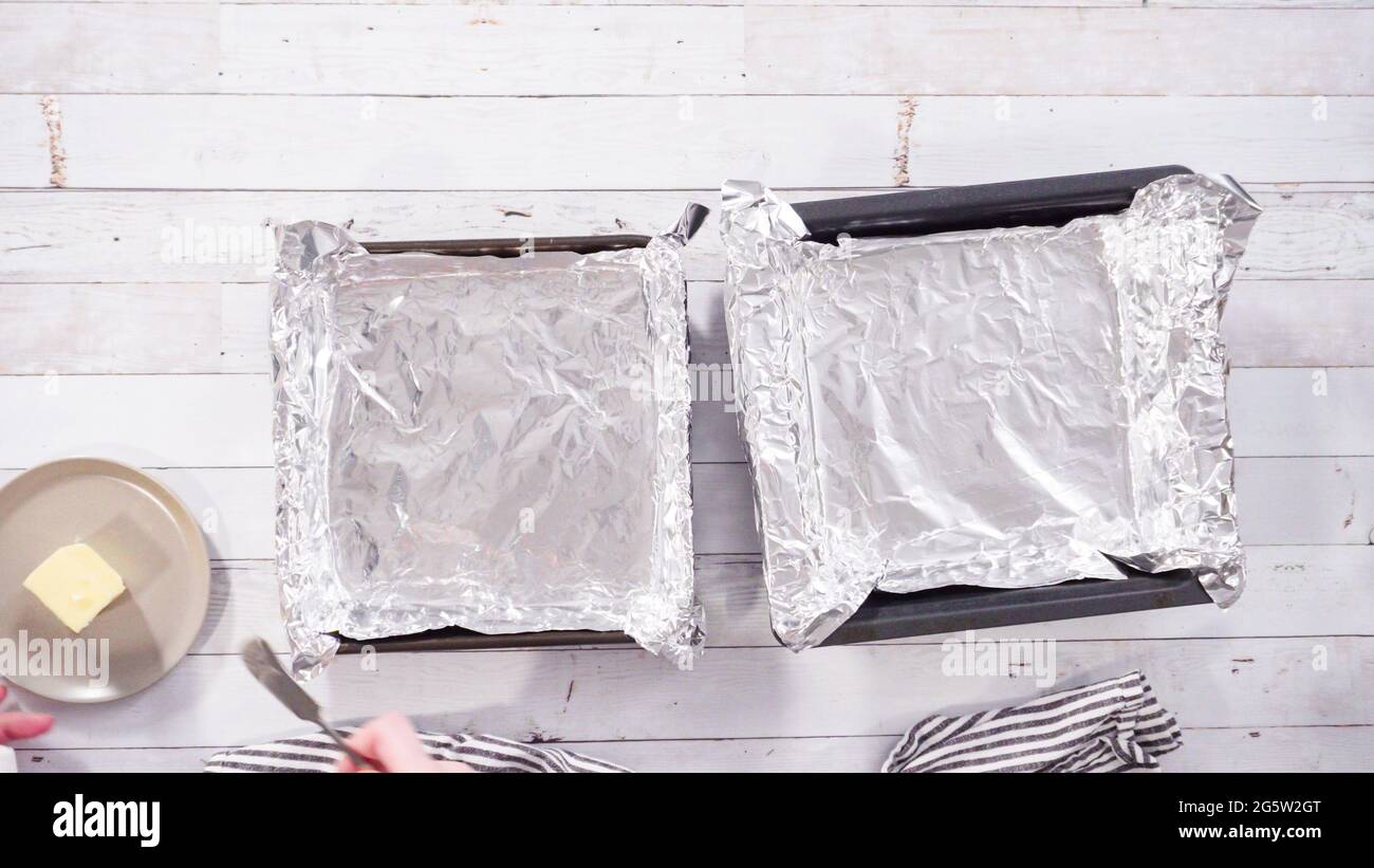 Flat lay. Step by step. Greasing baking pan to make homemade fudge ...