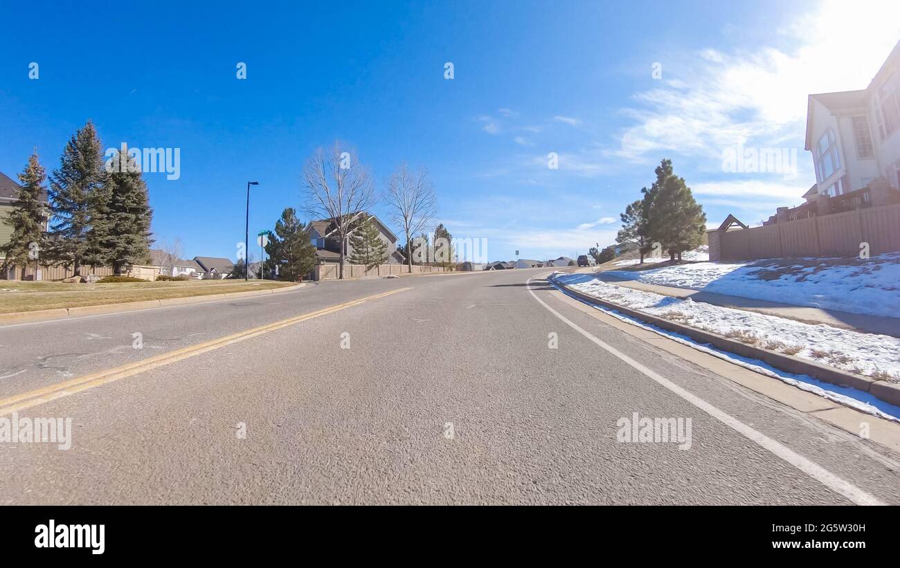 Driving on typical paved roads in a suburban upscale residential ...