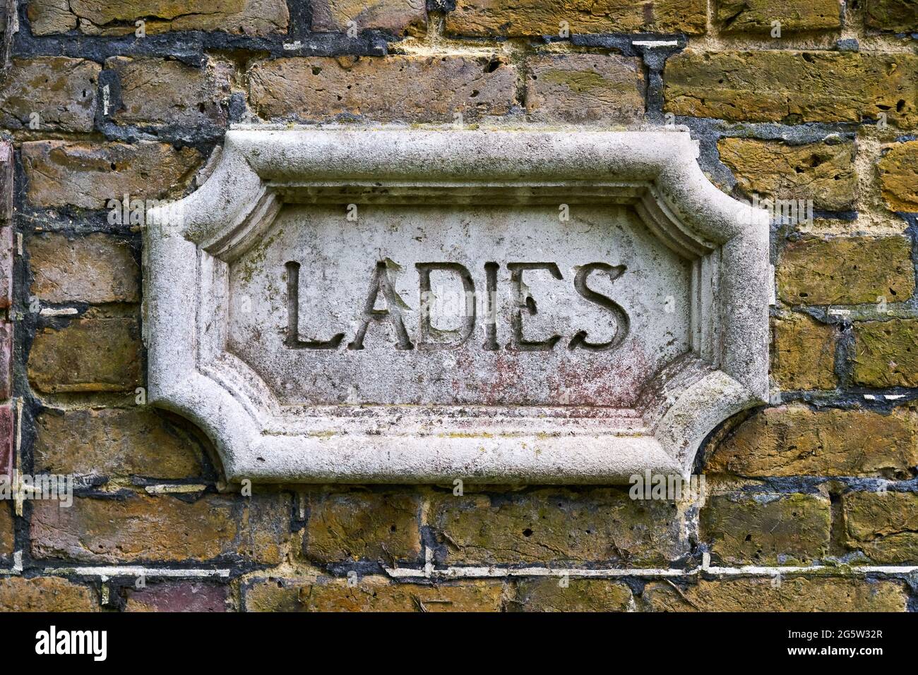 A Victorian Ladies sign for the bathroom cast in concrete Stock Photo ...