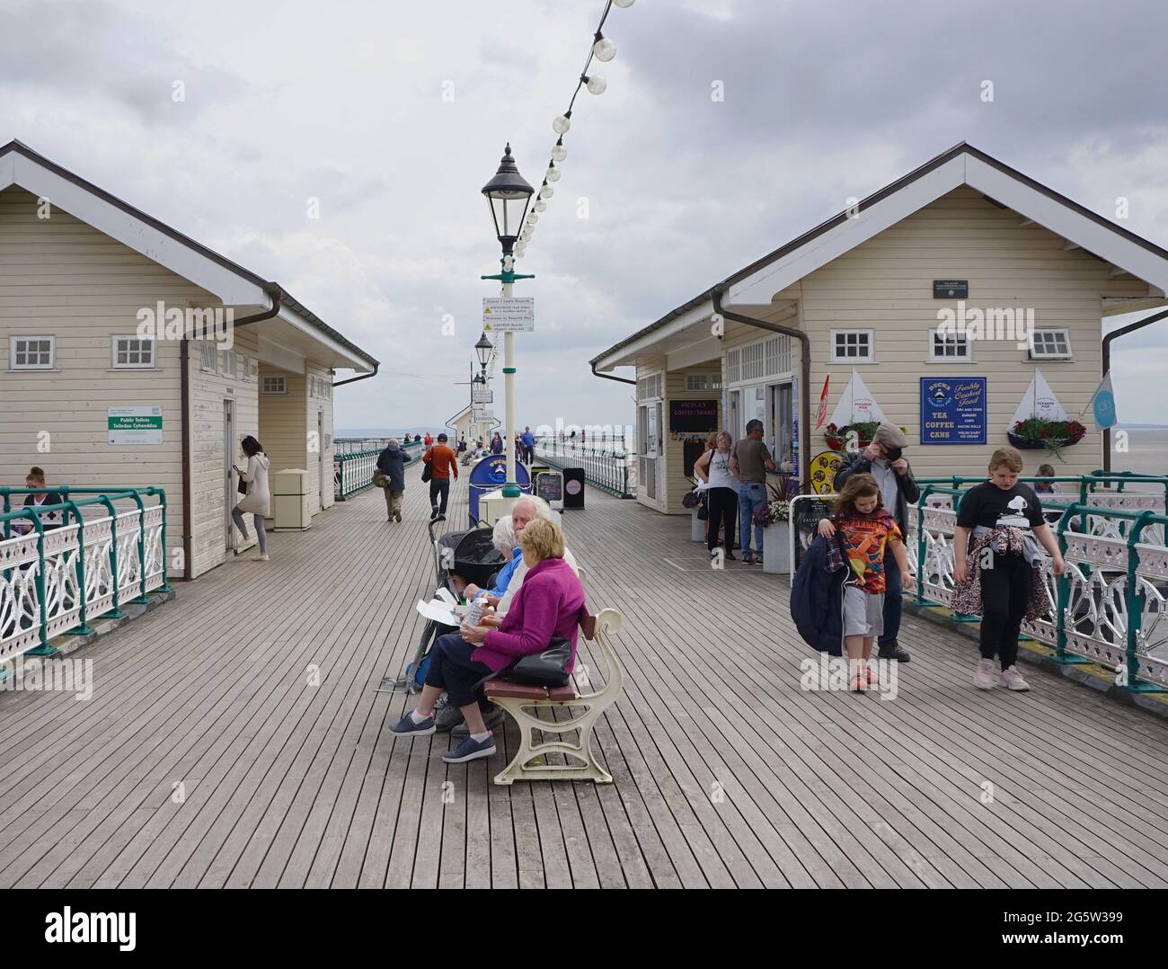 Eating Fish and Chips on Pier Stock Photo - Alamy