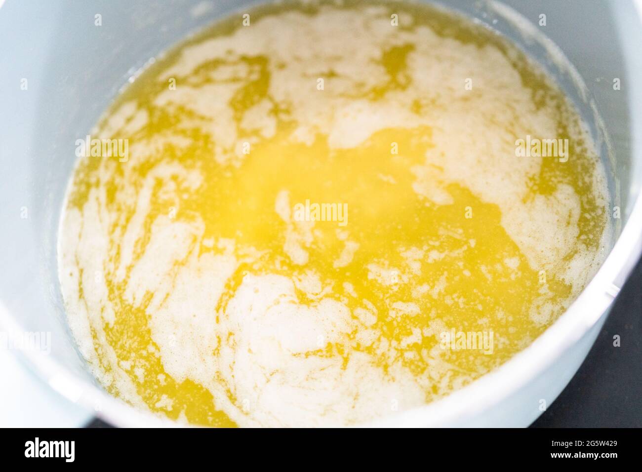 Melting butter sticks in a saucepan for baking a cake Stock Photo - Alamy