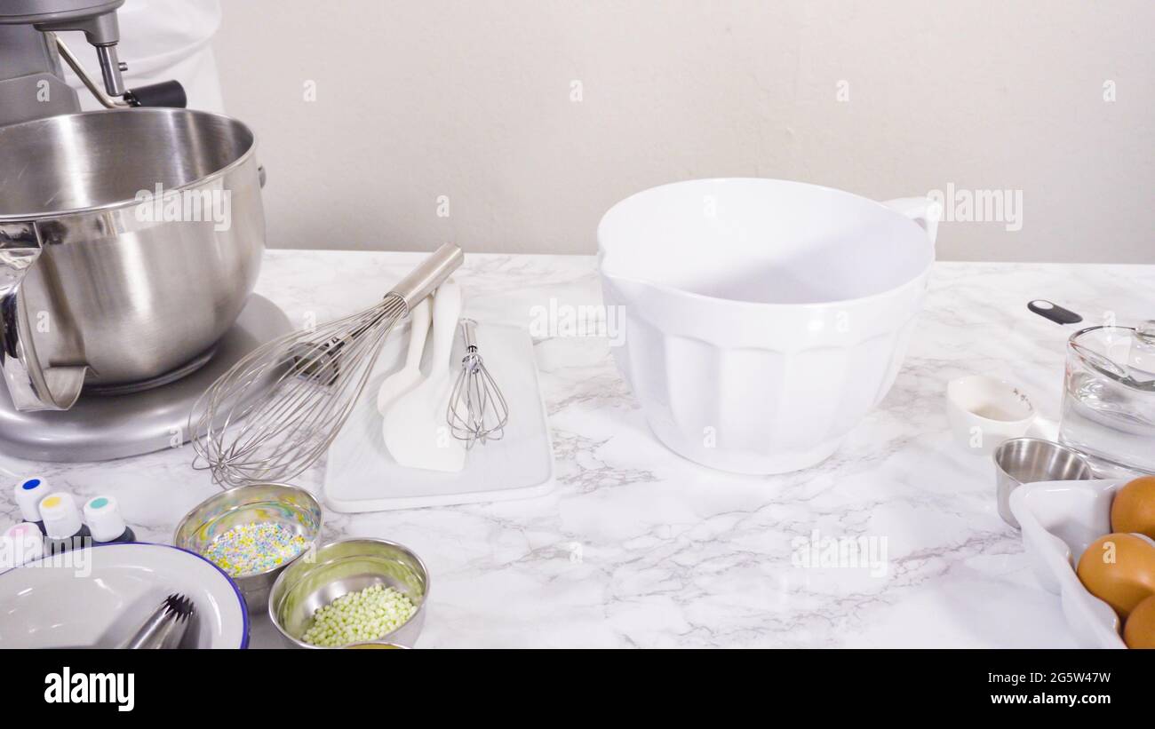 Mixing ingredients to bake sheet cake with Italian buttercream frosting ...