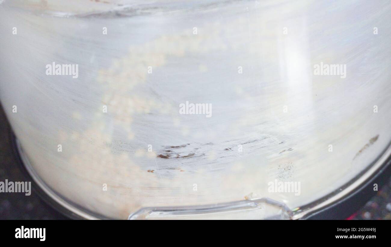 Preparing popcorn in popcorn maker machine Stock Photo - Alamy