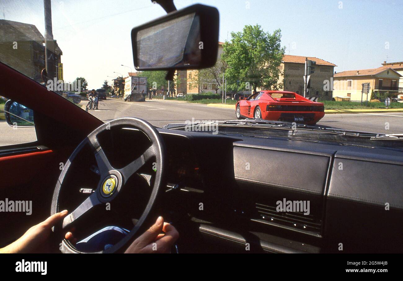Driving a classic Ferrari in Maranello Italy Stock Photo - Alamy