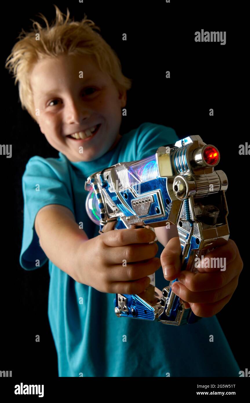 Boy with light gun hi-res stock photography and images - Alamy