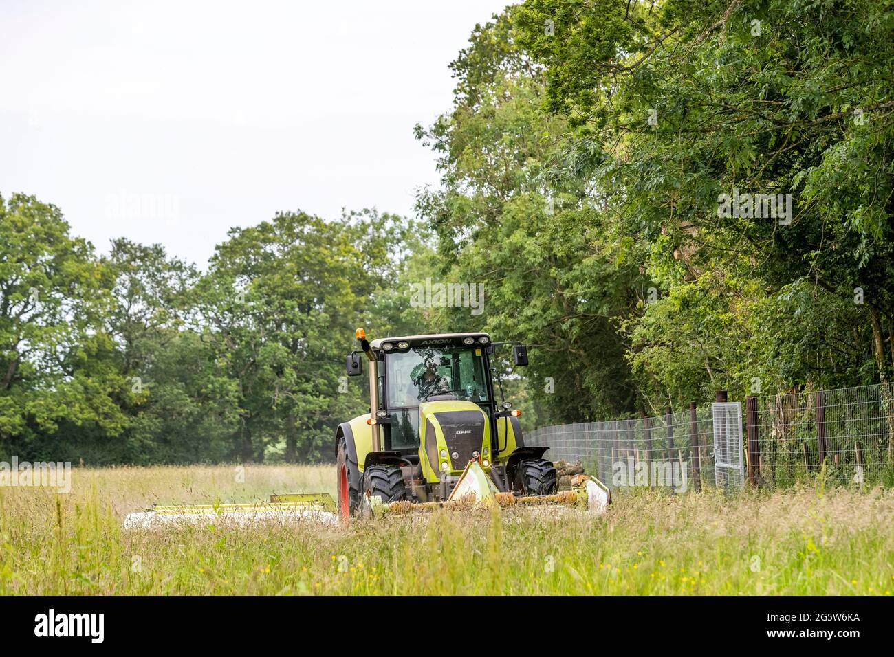 Summer grass cutting, Forest of Dean. CLAAS 820 Axion tractor and ...