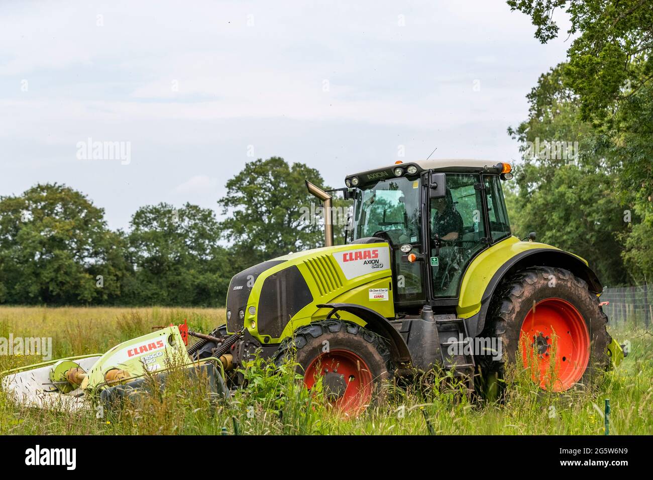 Summer grass cutting, Forest of Dean. CLAAS 820 Axion tractor and ...