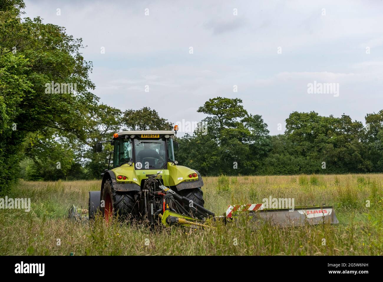 Summer grass cutting, Forest of Dean. CLAAS 820 Axion tractor and ...