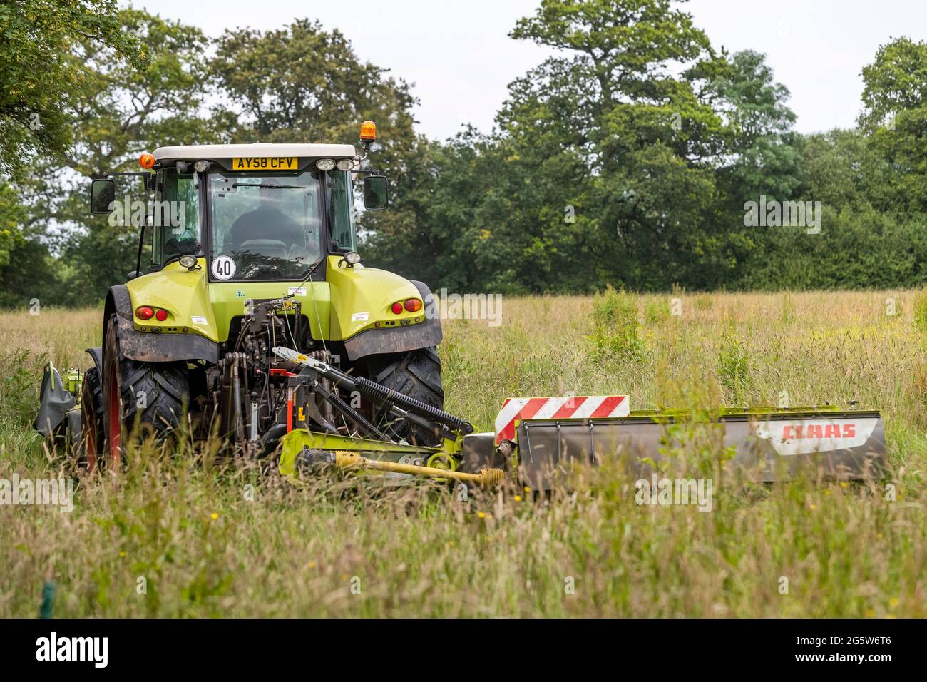 Summer grass cutting, Forest of Dean. CLAAS 820 Axion tractor and ...