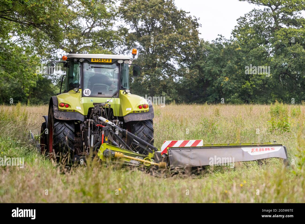 Summer grass cutting, Forest of Dean. CLAAS 820 Axion tractor and ...