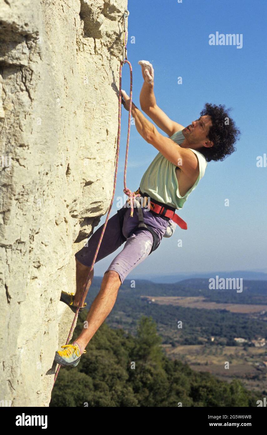 Climbing in Claret: France, climber Pierre Rouzo Stock Photo - Alamy