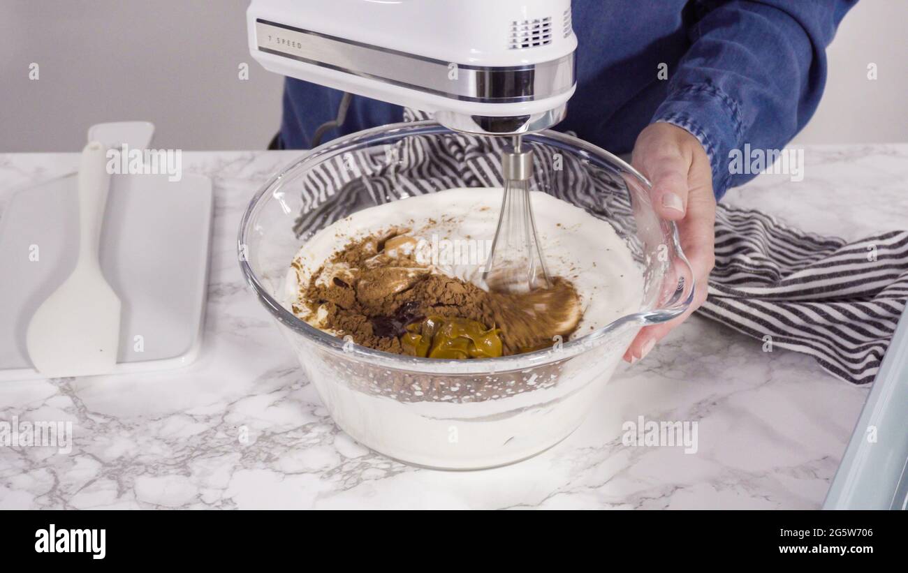 Step by step. Preparing homemade chocolate ice cream in a hand kitchen ...