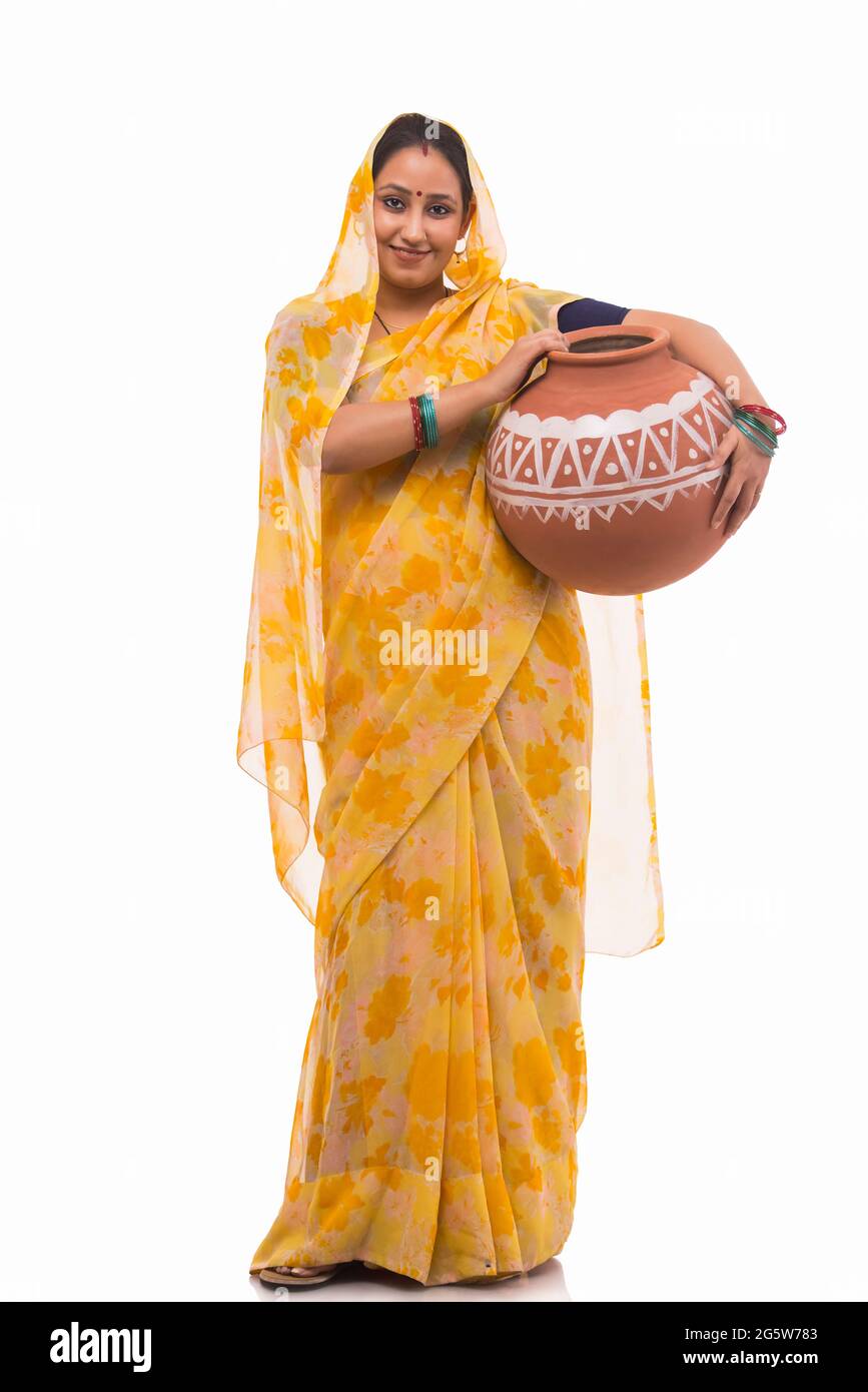 Indian woman holding water pot hi-res stock photography and images - Alamy