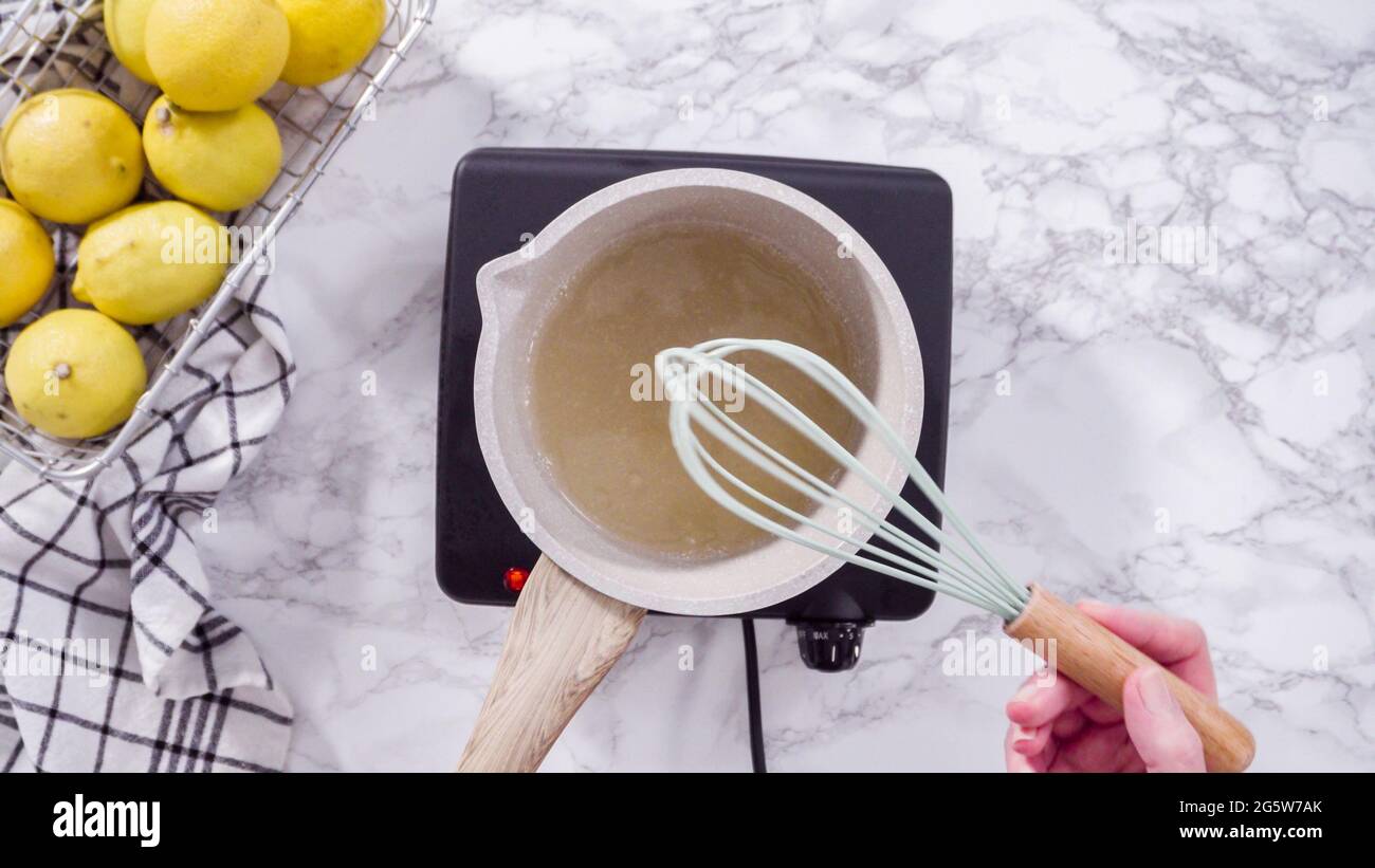 Step by step. Flat lay. Cooking cake syrup for cake in a saucepan Stock ...