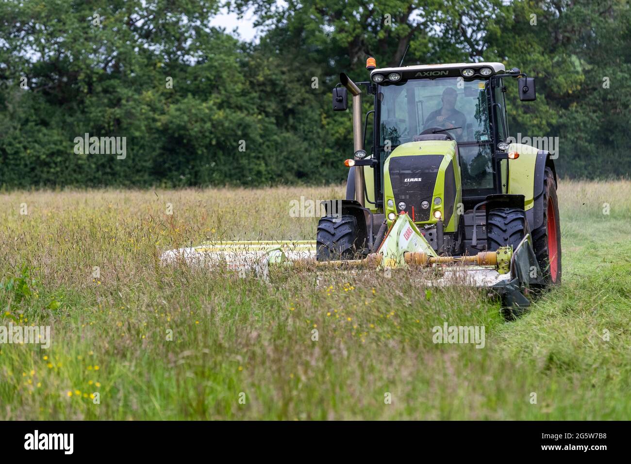 Summer grass cutting, Forest of Dean. CLAAS 820 Axion tractor and ...