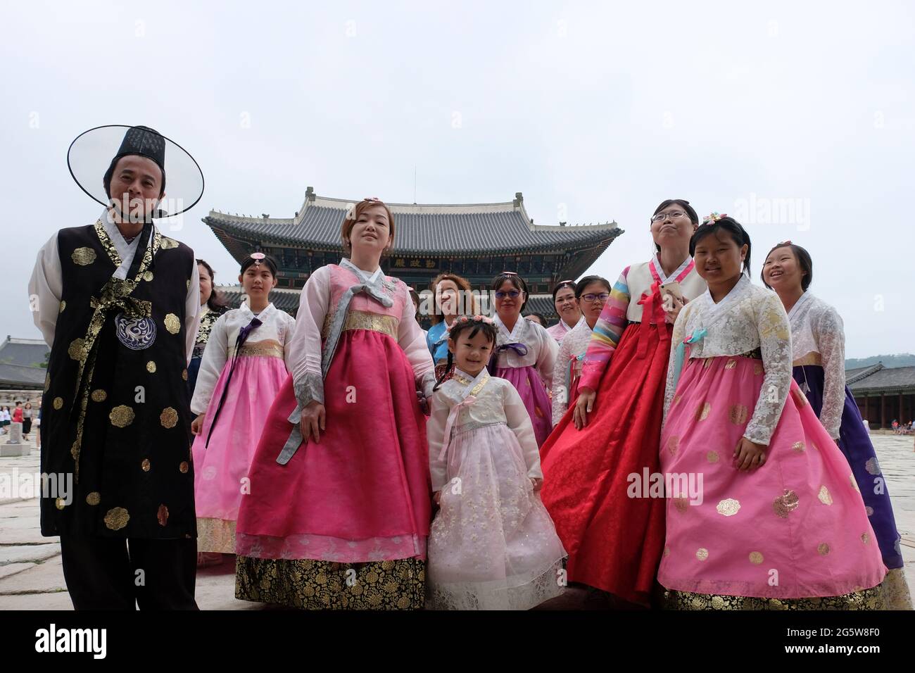 Visitors in traditional costumes at Gyeongbokgung or Gyeongbok Palace ...