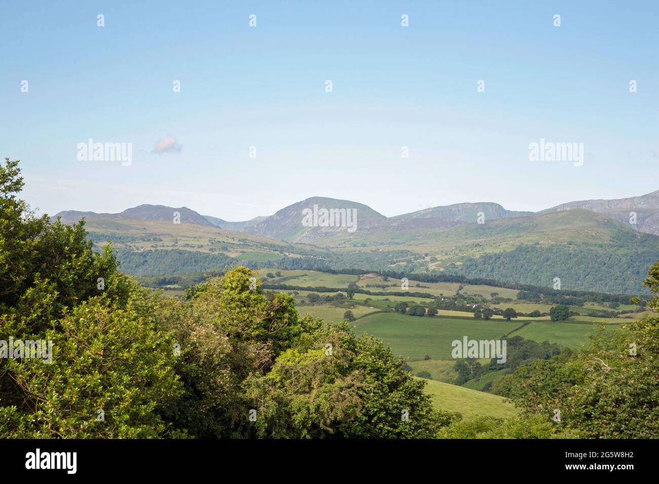 Summer morning the Conwy Valley viewed from hills above the village of ...