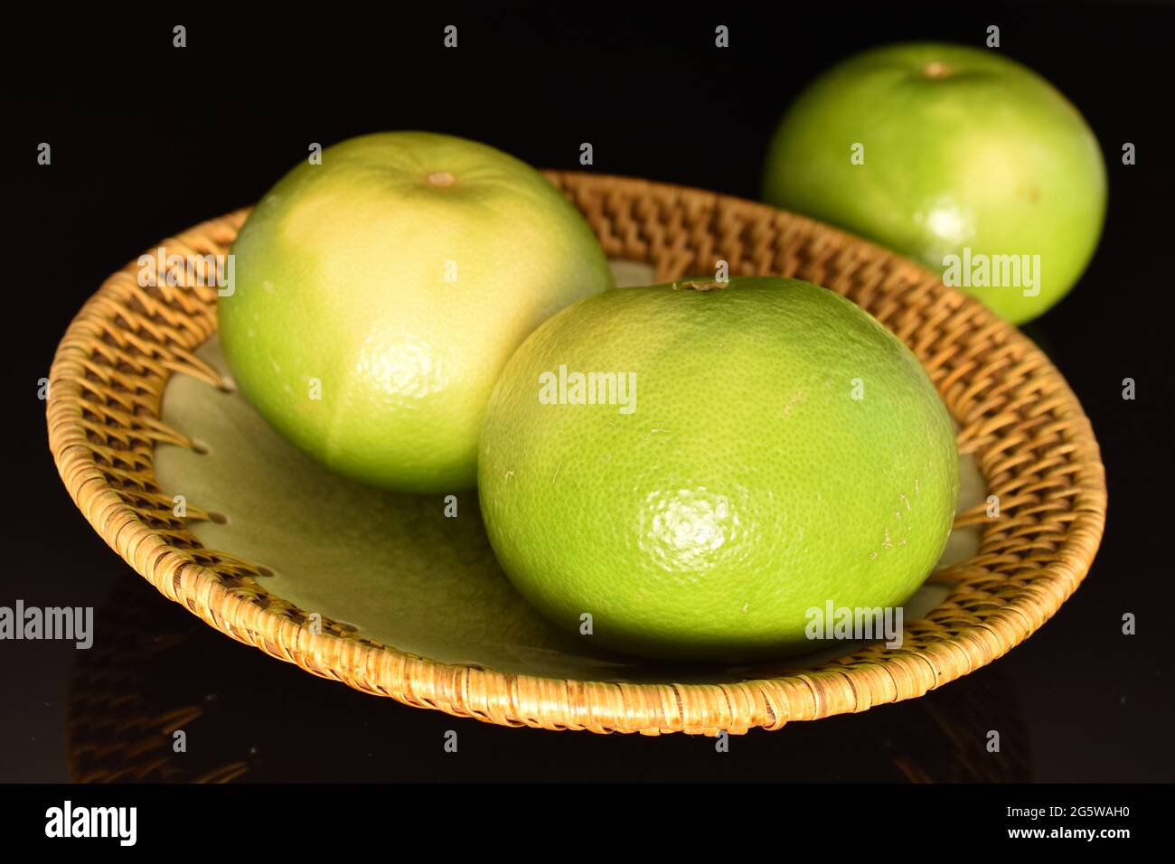 Three Ripe Organic Citrus Sweetie With A Ceramic Plate Close Up 2530