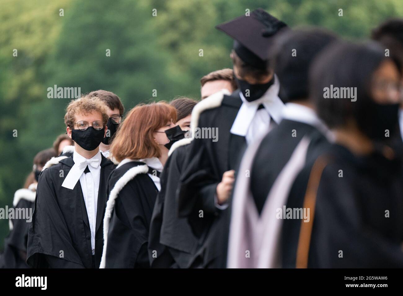 Students from King's College prepare for the procession to Senate House ...