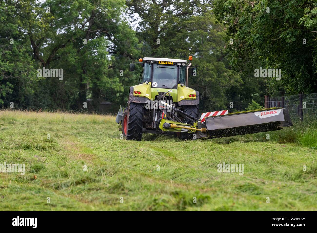 Summer grass cutting, Forest of Dean. CLAAS 820 Axion tractor and ...
