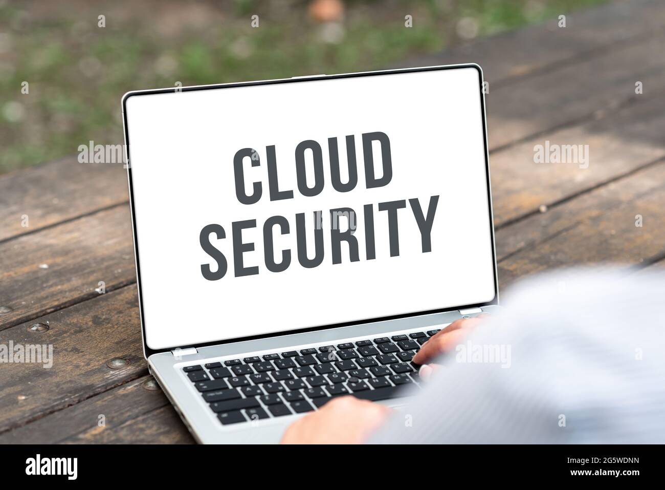 Hand Writing Sign Cloud Security Word Written On Imposing A Secured System Of Existing Data In
