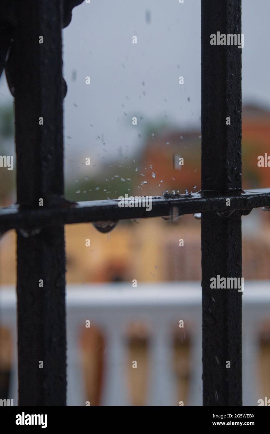 Raindrops Splashing on Metal Gate Stock Photo - Alamy