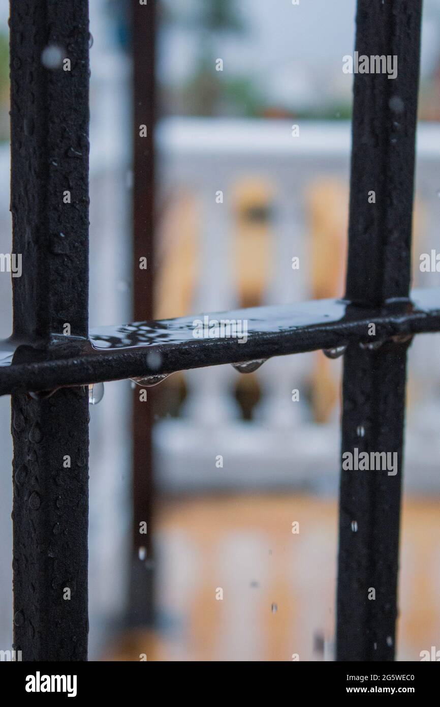 Raindrops Splashing on Metal Gate Stock Photo - Alamy