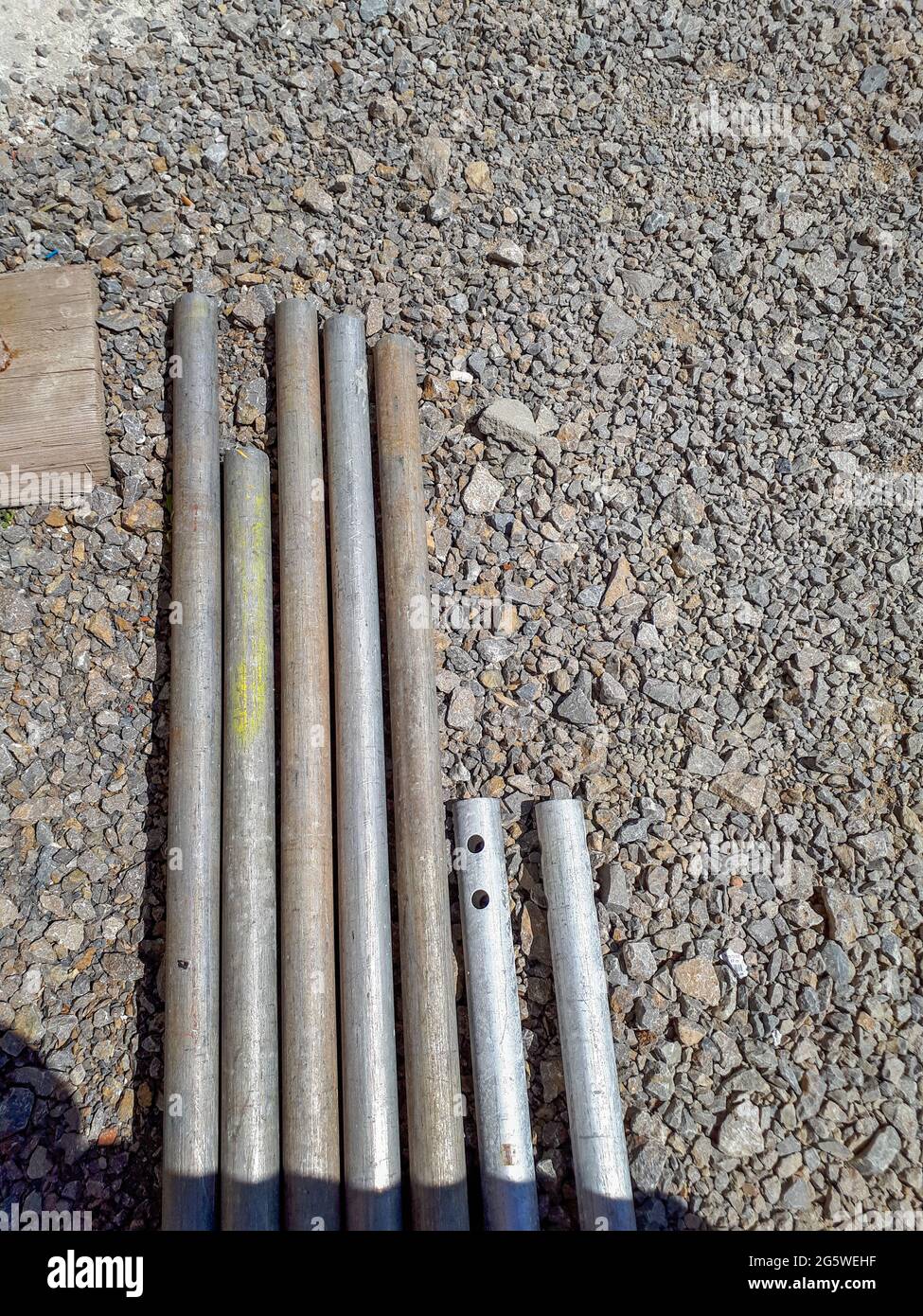 Round-shaped steel pipe for construction with rust on the ground Stock ...