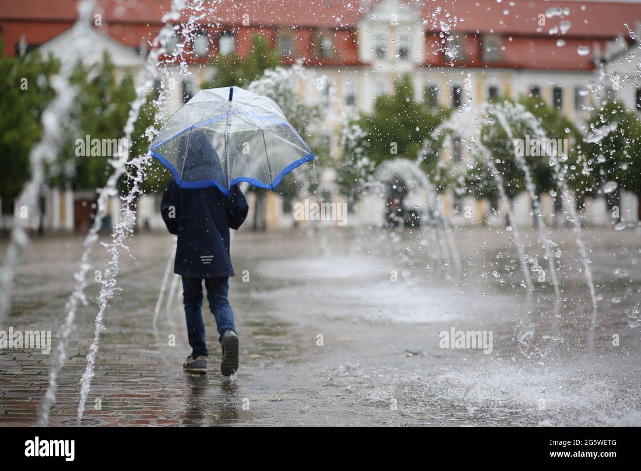 Magdeburg, Germany. 30th June, 2021. A child walks with a sign through ...