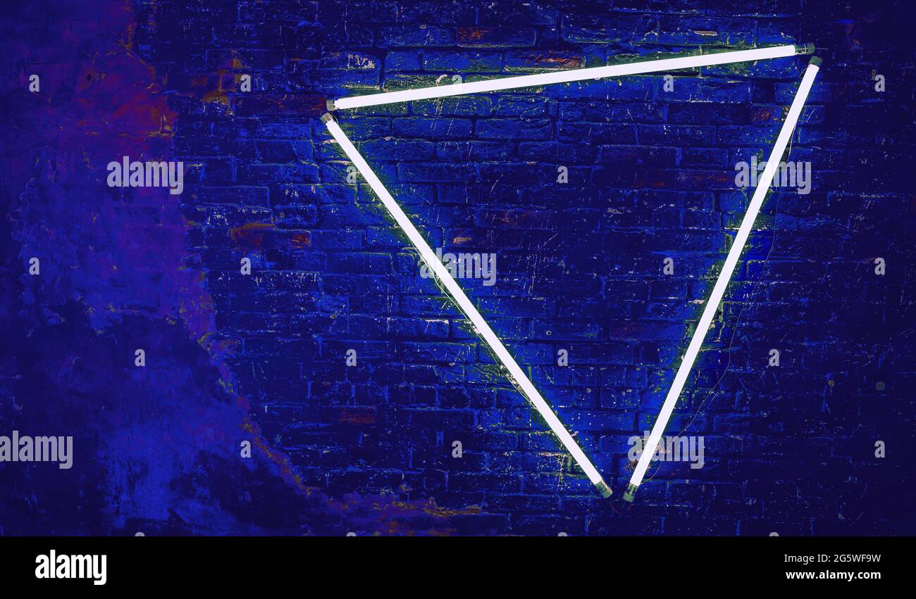 Modern interior of brick wall with glowing lamps in form of triangle ...