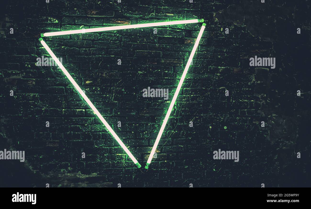 Modern interior of brick wall with glowing lamps in form of triangle ...