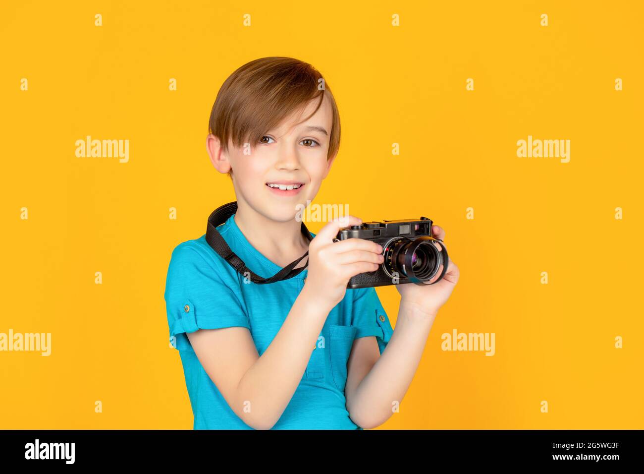 Baby boy with camera. Cheerful smiling child holding a cameras. Little ...