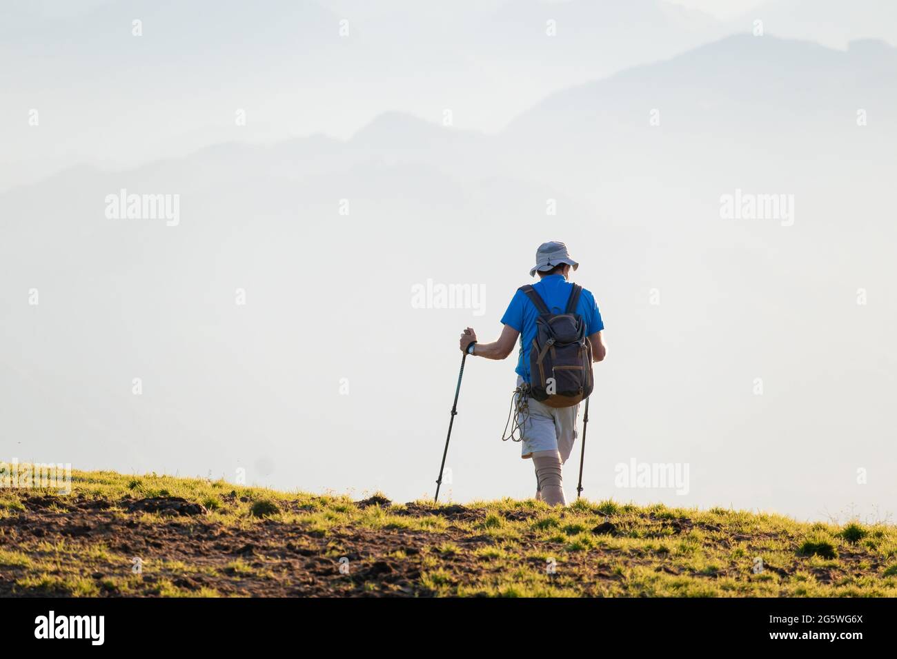 Man hiking backpack sticks hi-res stock photography and images - Alamy