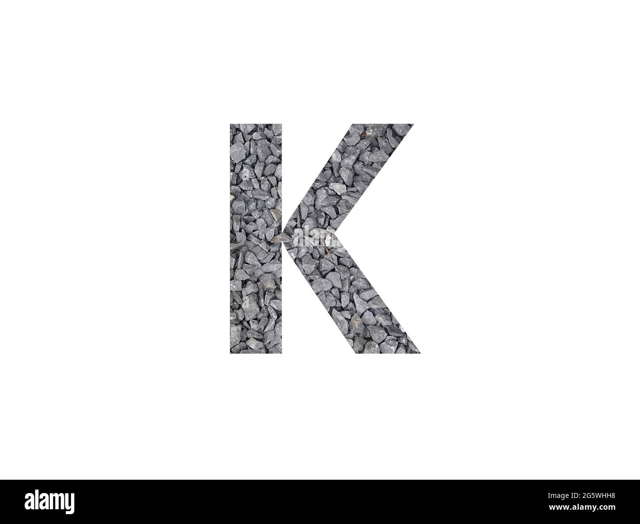 Letter K of the alphabet made with grey gravel isolated on a white ...