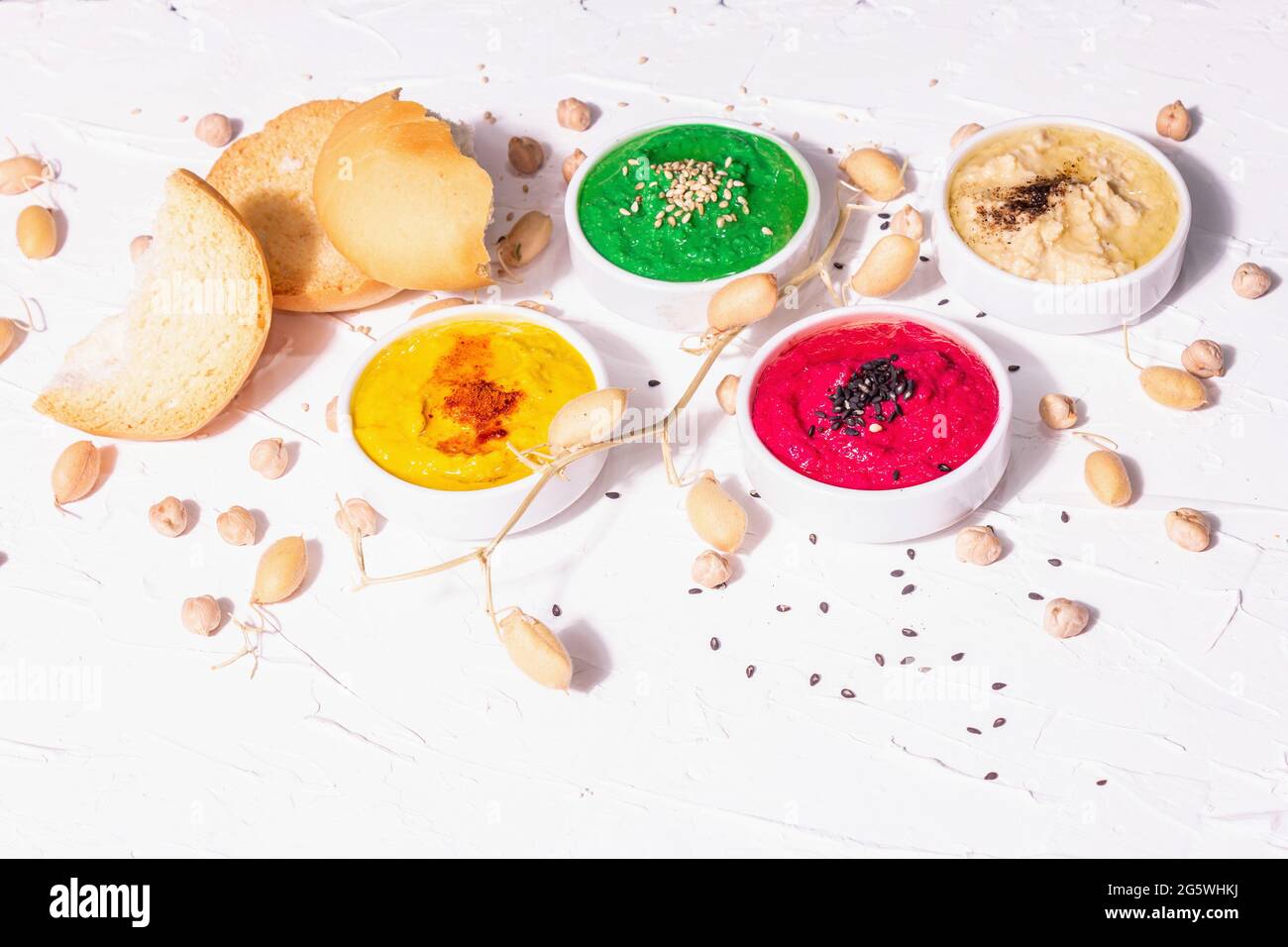 Various hummus dips, the flat lay of hummus in different colors with ...