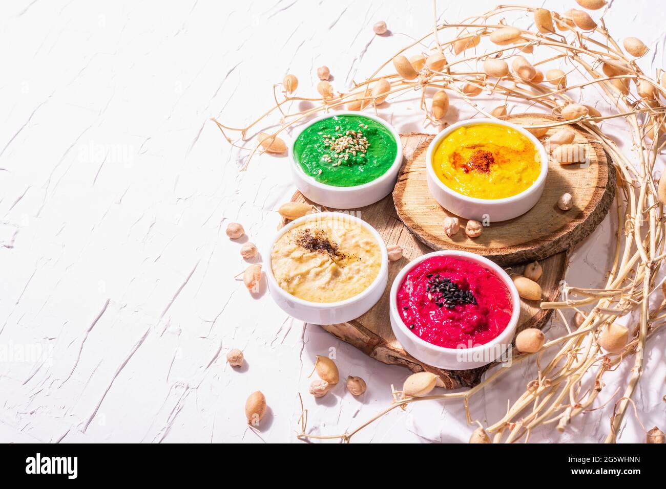 Various hummus dips, the flat lay of hummus in different colors with ...