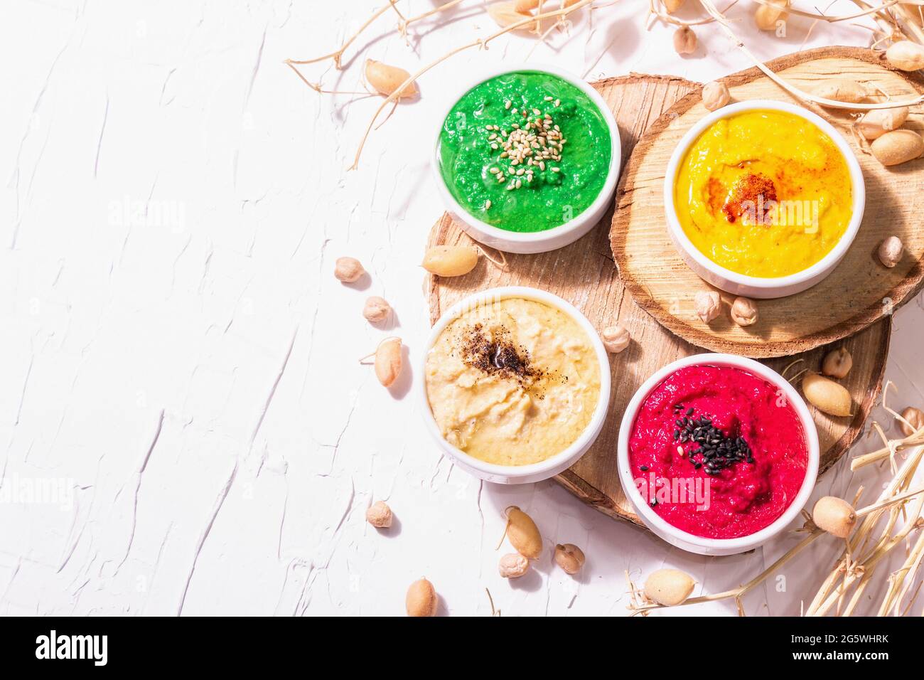 Various hummus dips, the flat lay of hummus in different colors with ...