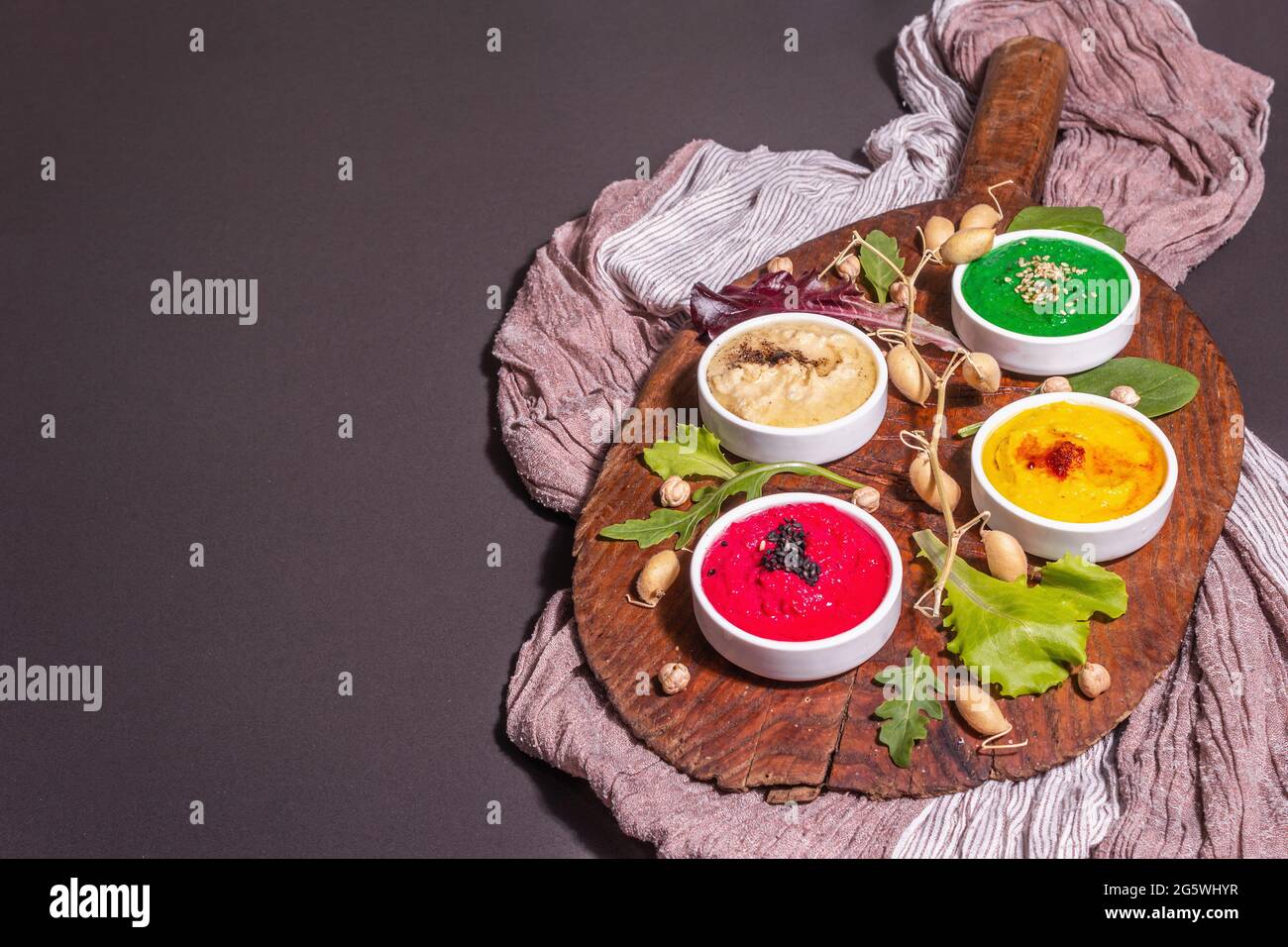 Colorful hummus bowls, healthy vegan dips. Traditional Middle Eastern ...