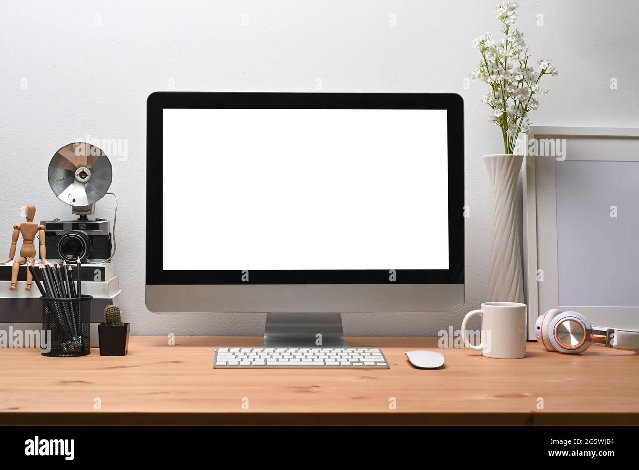 Front view mock up computer, photo frame, books, pencil holder and ...