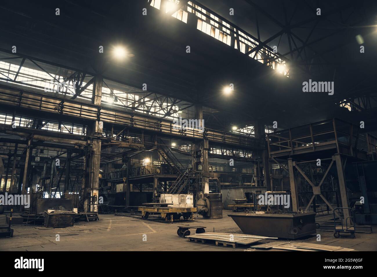 Industrial building inside. Metallurgical plant interior. Large dark ...