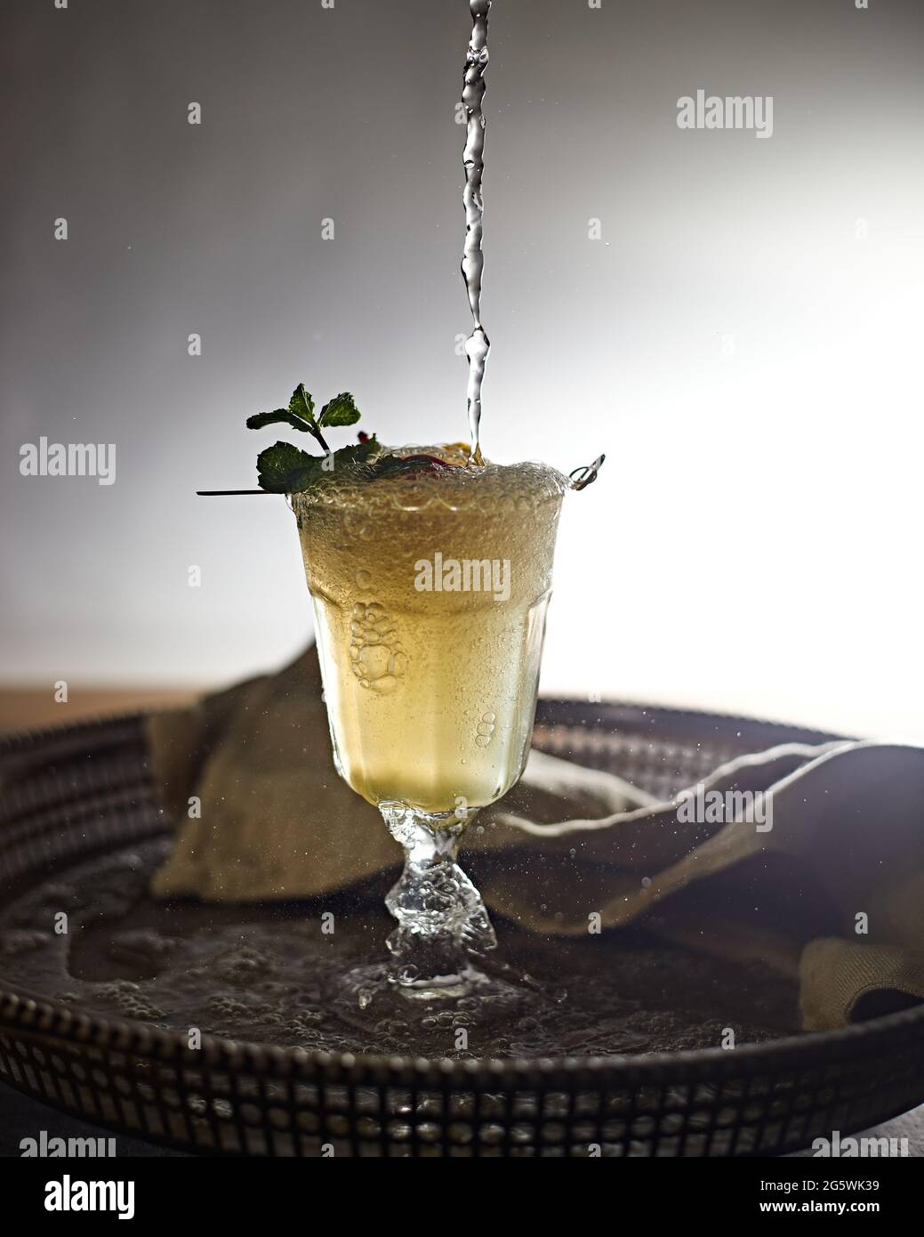Pouring soda water from a can to make cocktail Stock Photo - Alamy