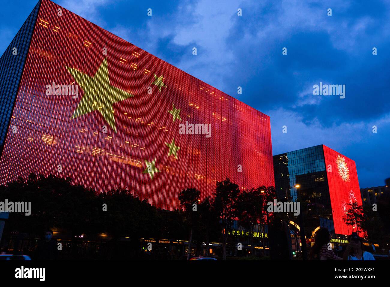 Flag of China seen displayed on a screen outside a building in Tsim Sha ...