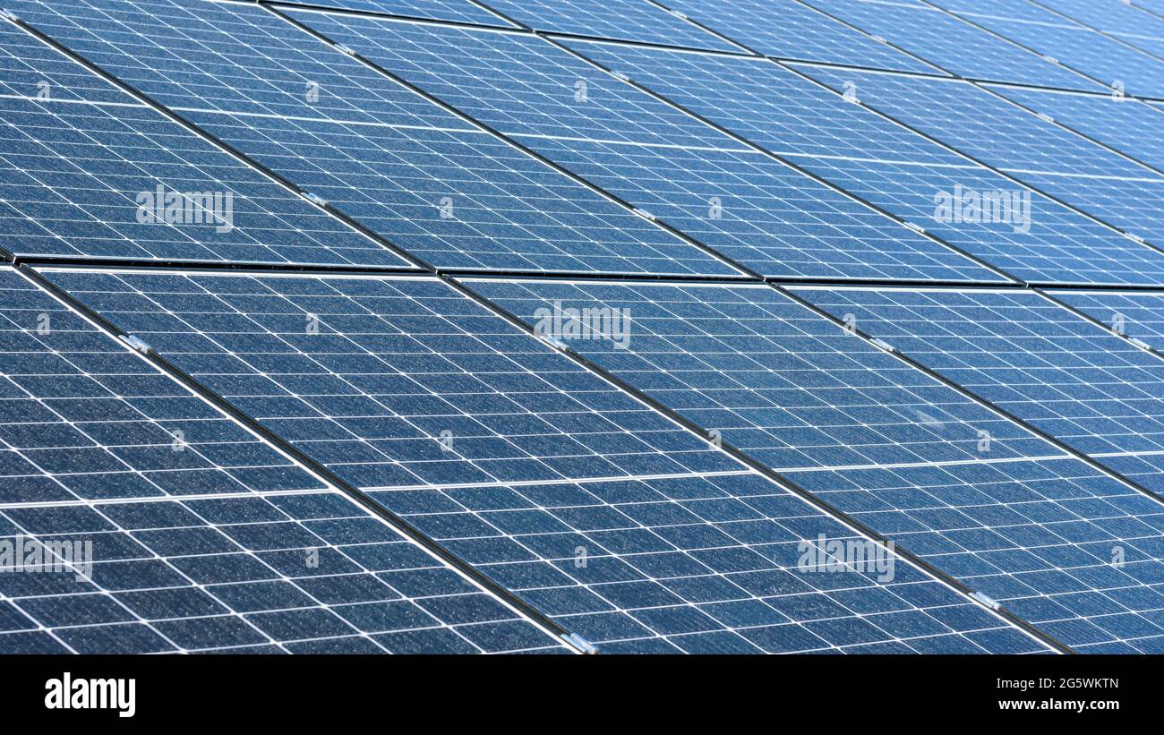 Green energy background made of solar panels Stock Photo - Alamy