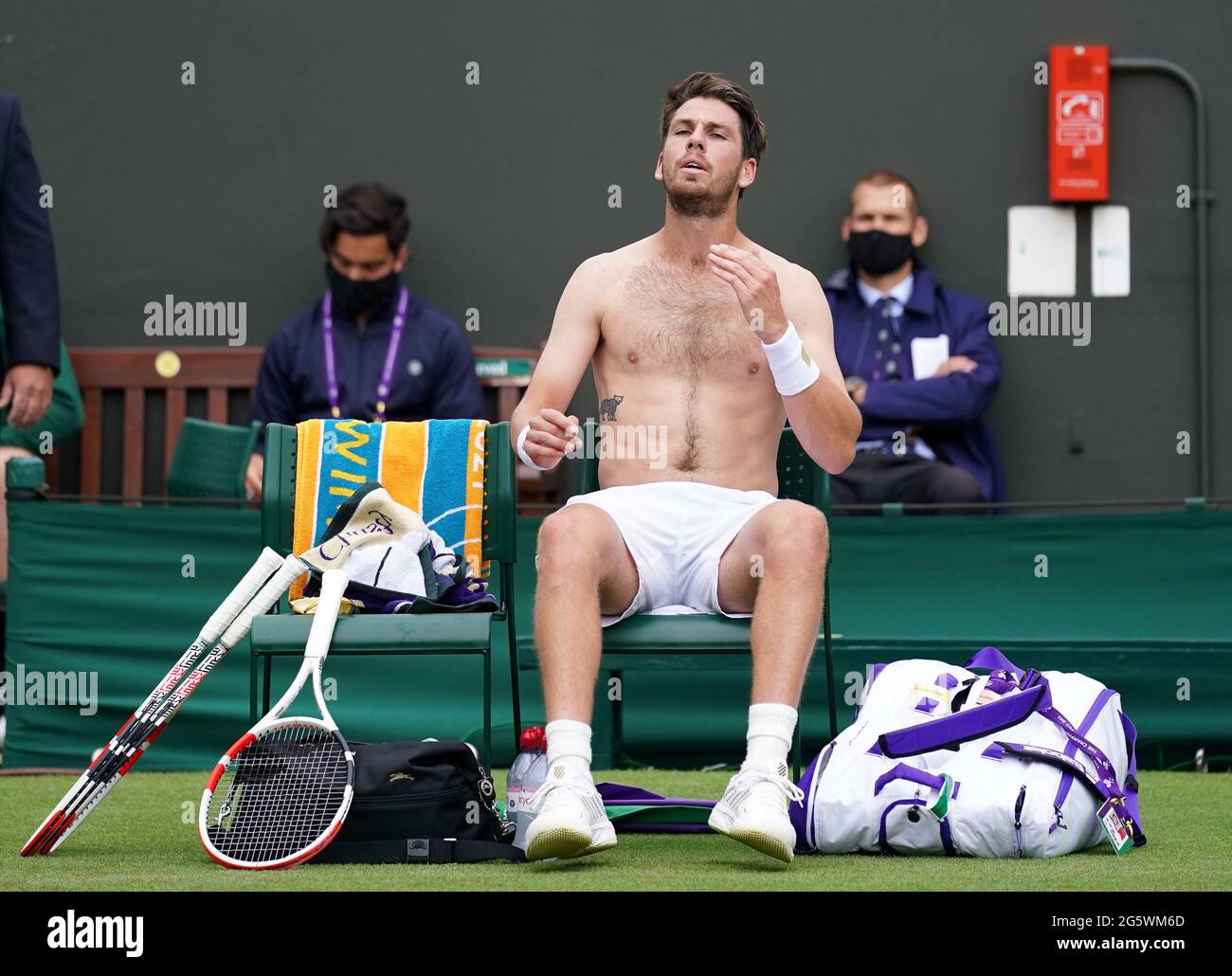 Cameron Norrie takes a break on court 2 on day three of Wimbledon at ...
