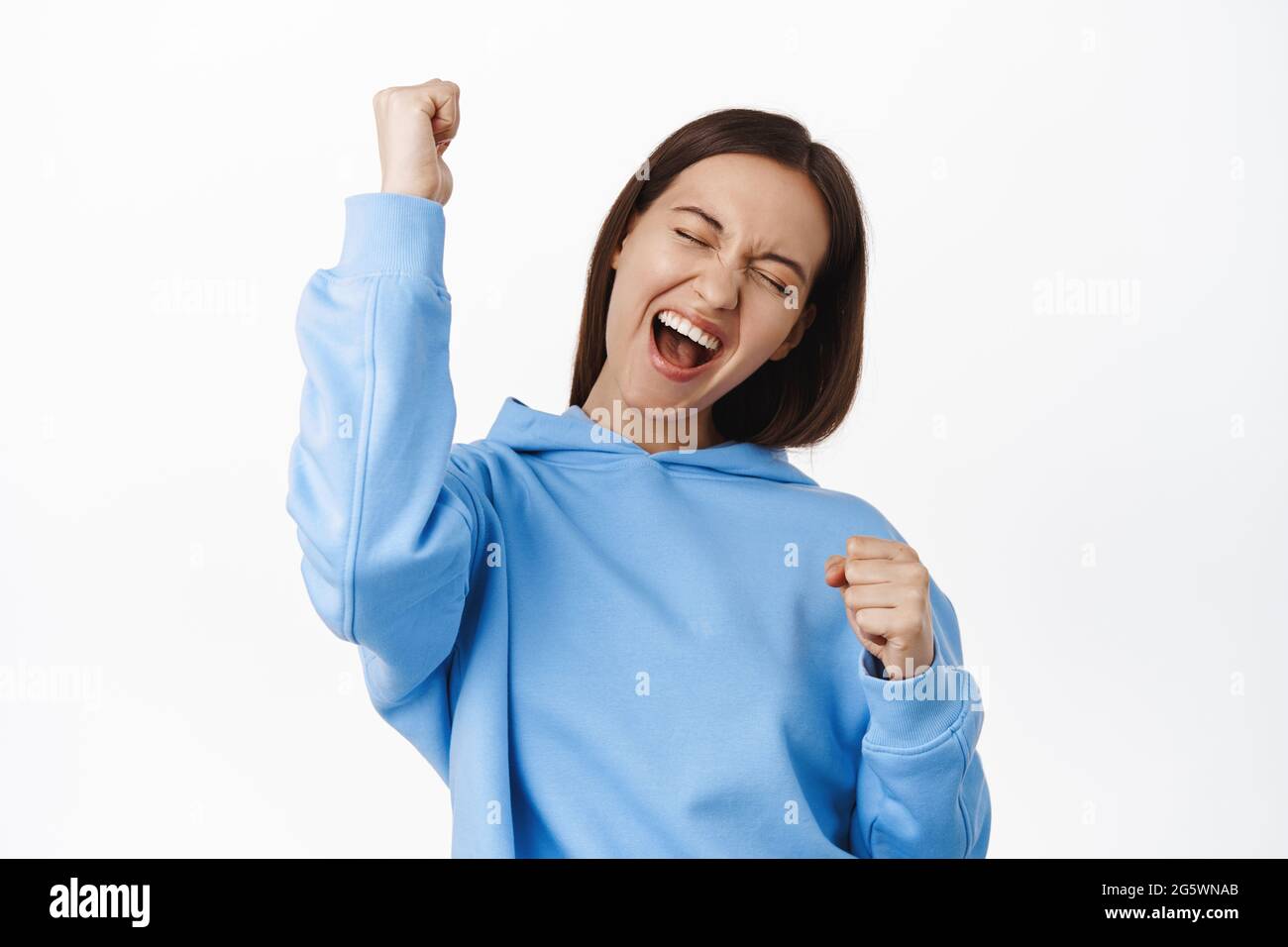 She is champion. Successful young woman winning, celebrating victory ...