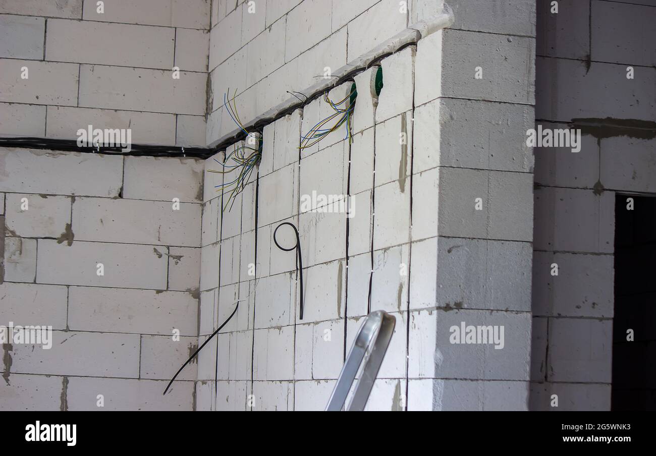 Electrical wiring in the house. Electric cable laying. Selective focus ...