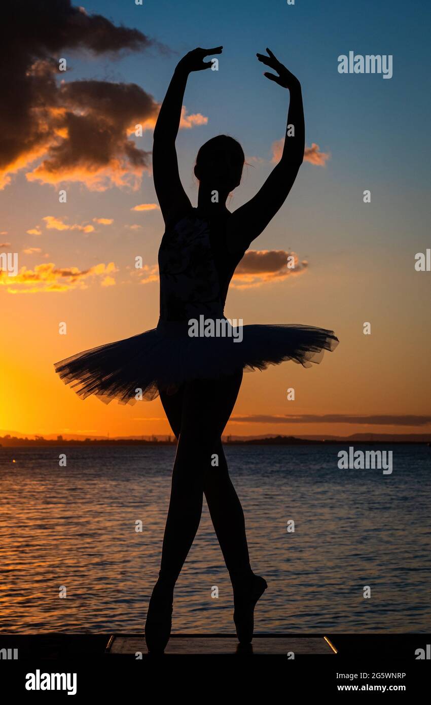 Ballerina Posing at Sunset Stock Photo - Alamy