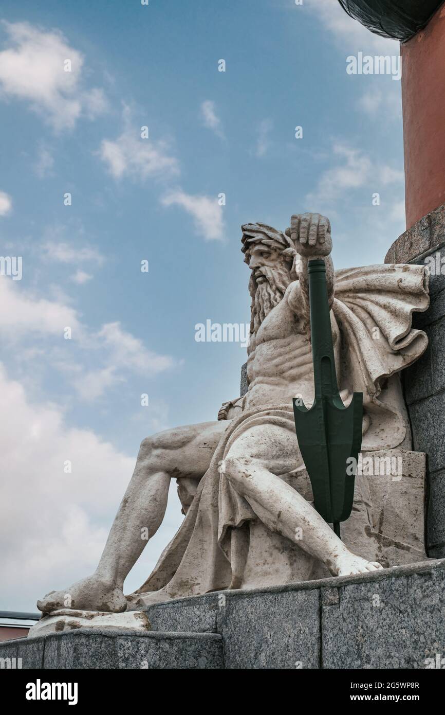 Ancient Roman statue near Rostral columns close-up against the ...